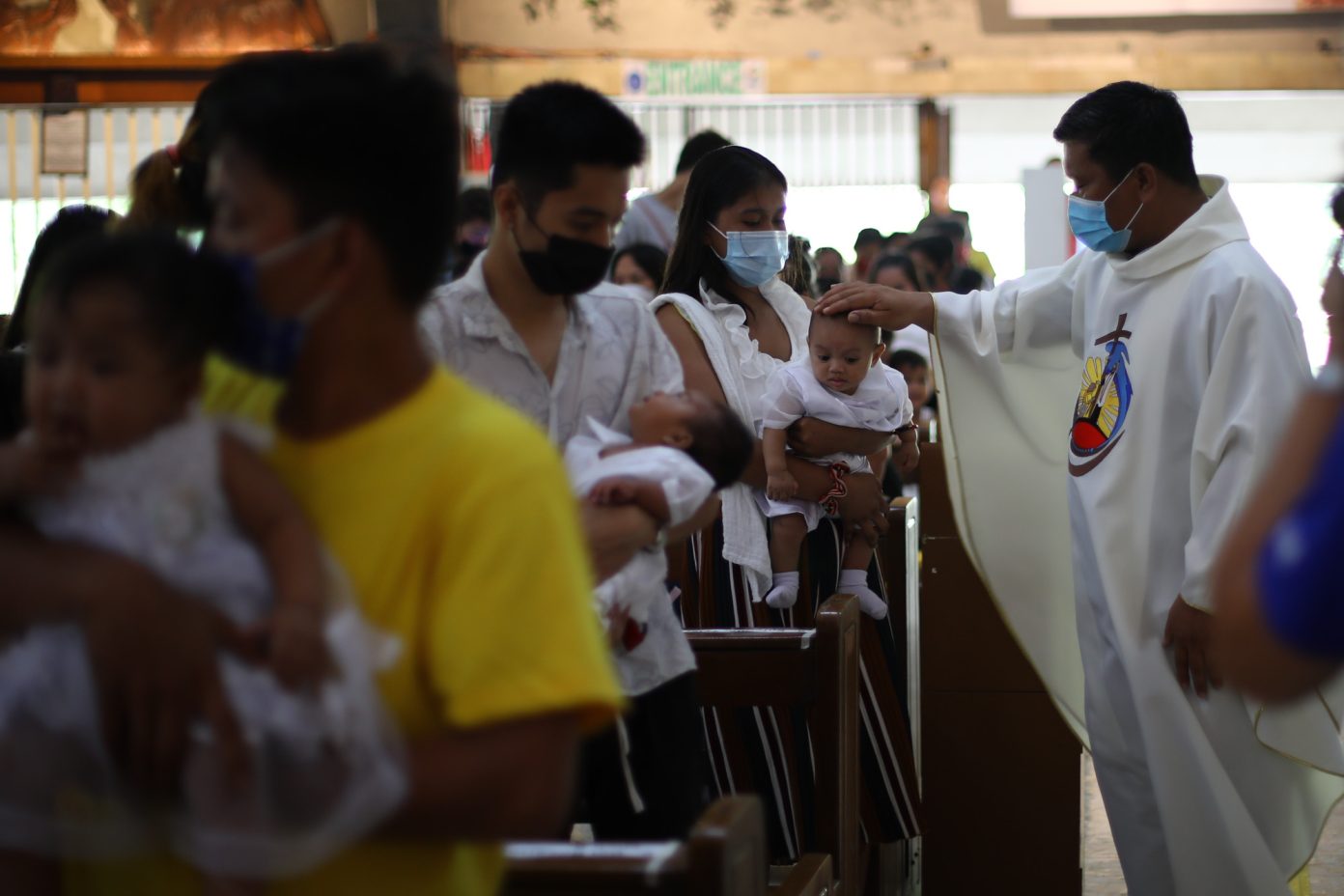 Photos: Quezon City church holds mass baptism following easing of ...